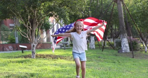 4k. Kid waving national USA flag outdoor... | Stock Video | Pond5