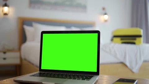 4K : A laptop computer with a key green ... | Stock Video | Pond5