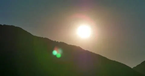4K Lens Flare of Setting Sun and Mountai... | Stock Video | Pond5