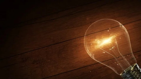 4K Light bulb Thinking . Wood background... | Stock Video | Pond5