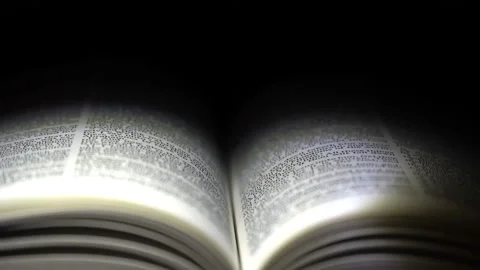 4k Light In The Darkness Bible Pages | Stock Video | Pond5