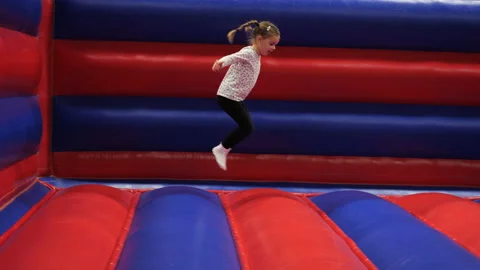 4K: Little Caucasian girl jumping on a ... | Stock Video | Pond5