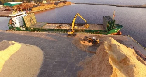 4K - Loading of a Ship timber carrier in... | Stock Video | Pond5