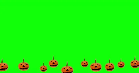 4K loop animation. Scary pumpkins on a g... | Stock Video | Pond5