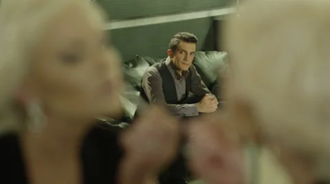 4K Mad man sitting on sofa and waiting f... | Stock Video | Pond5