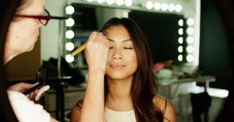 4K Makeup artist preparing beautiful mod... | Stock Video | Pond5