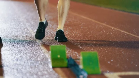 4K Male runners at athletics track crouc... | Stock Video | Pond5