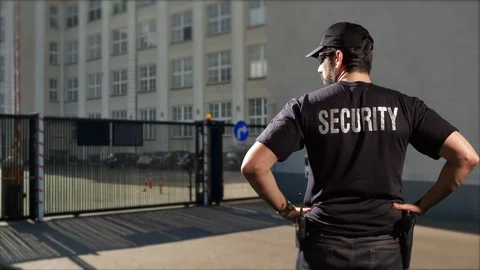 4K Male Security Guard at Entrance Gate ... | Stock Video | Pond5