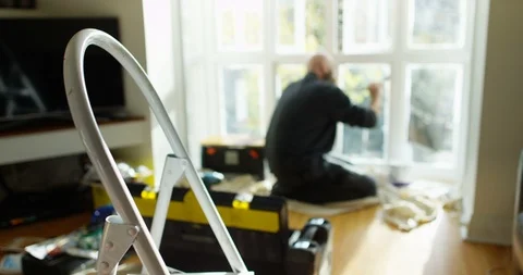 4K Man painting home interior window fra... | Stock Video | Pond5