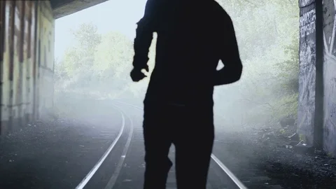 4K Man running away fast on foggy train ... | Stock Video | Pond5
