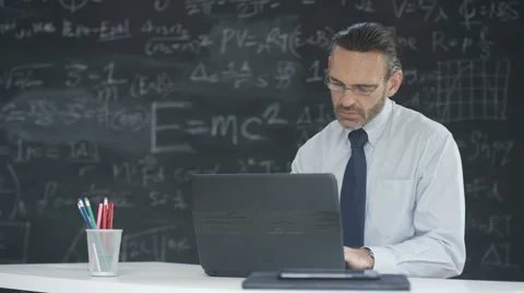 4K Man using laptop in classroom, studyi... | Stock Video | Pond5