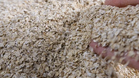 4K mans hands checking Dry oats falling ... | Stock Video | Pond5