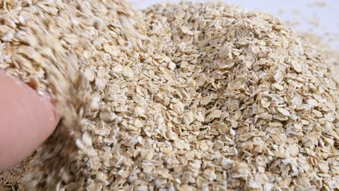4K mans hands checking Dry oats falling ... | Stock Video | Pond5