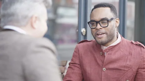 4K Men chatting at outdoor city cafe tab... | Stock Video | Pond5