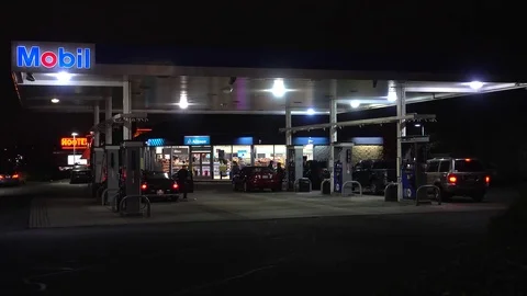 4K Mobil gas station fuel pump customers... | Stock Video | Pond5