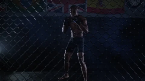 4K Muscular MMA fighter training alone i... | Stock Video | Pond5