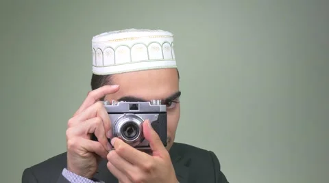 4K Muslim Photographer Using Camera | Stock Video | Pond5