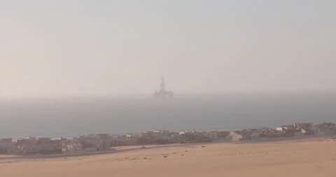 4K Offshore oil rig in Desert Town of Sw... | Stock Video | Pond5