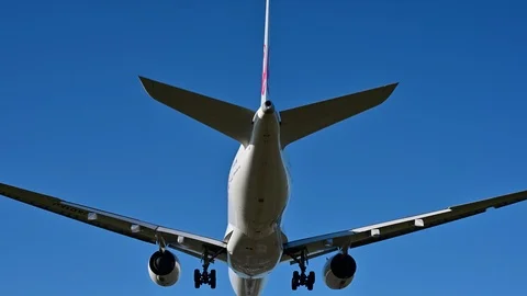 4K Overhead flying aircraft landing with... | Stock Video | Pond5