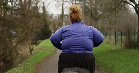 4K Overweight woman in leisure wear walk... | Stock Video | Pond5