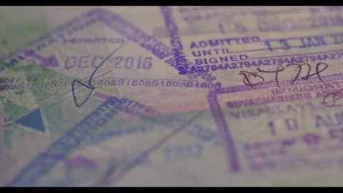 4K Panning shot of Visa Stamp in Passpor... | Stock Video | Pond5