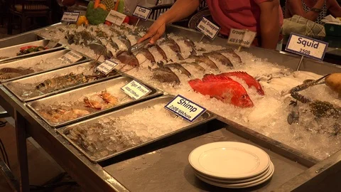4K People choose fresh fish prawn at Asi... | Stock Video | Pond5