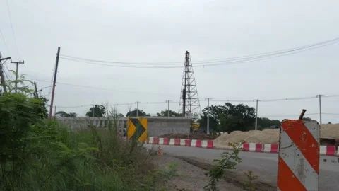 4K Piling machine working on 4 lane road... | Stock Video | Pond5
