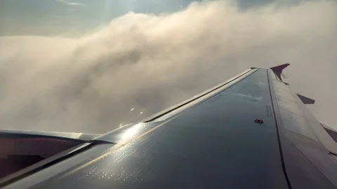 4K, Plane wing flying through the white ... | Stock Video | Pond5