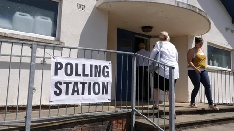 4K: Polling Station Sign, People walking... | Stock Video | Pond5