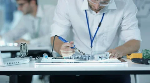 4K Portrait smiling electronics engineer... | Stock Video | Pond5