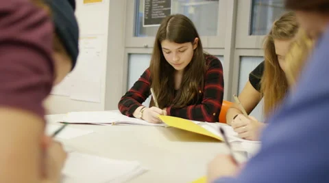 4K Portrait of smiling girl writing at h... | Stock Video | Pond5