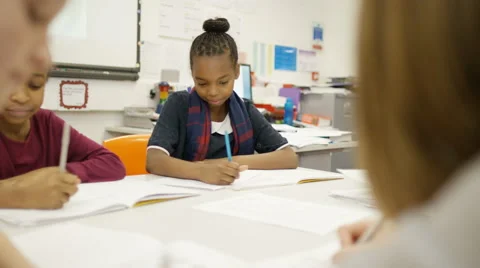 4K Portrait of smiling girl writing at h... | Stock Video | Pond5