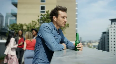4K Portrait smiling man drinking beer & ... | Stock Video | Pond5
