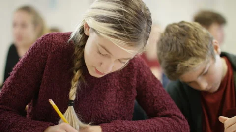 4K Portrait of young girl writing at her... | Stock Video | Pond5