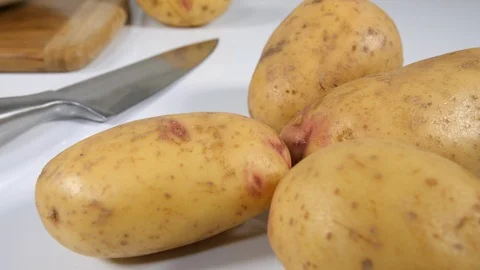 4K potato in kitchen on white background... | Stock Video | Pond5