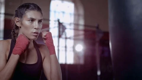 4K Powerful female boxer training with p... | Stock Video | Pond5