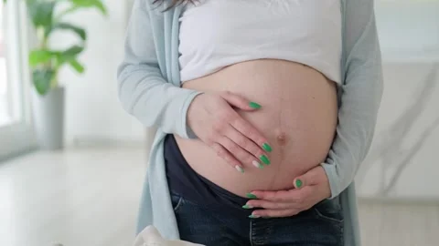 4k Pregnant expectant mother caressing h... | Stock Video | Pond5