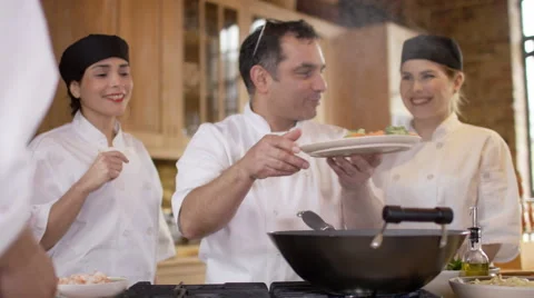 4K Professional chef with trainees in ki... | Stock Video | Pond5
