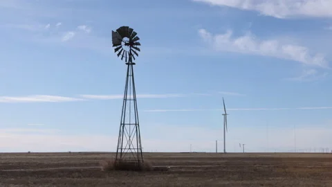 4K Real time of an old windmill and mode... | Stock Video | Pond5