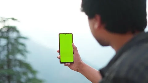 4K Rear view shot of an Indian man swipi... | Stock Video | Pond5