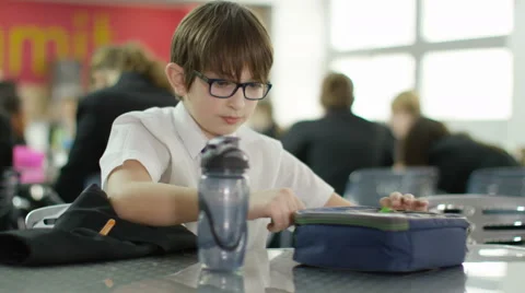 4K Sad boy eating lunch alone in school ... | Stock Video | Pond5