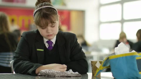 4K Sad girl eating lunch alone in school... | Stock Video | Pond5