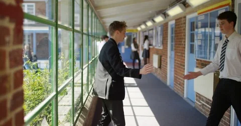 4K School boys greeting each other with ... | Stock Video | Pond5