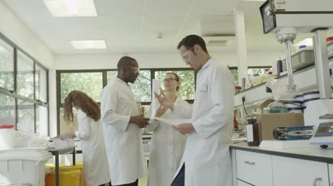 4K Science Lab and scientists working on... | Stock Video | Pond5