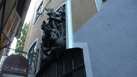 4k Sculpture in small alley building in ... | Stock Video | Pond5