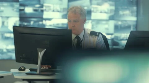 4K Security officer watching the screens... | Stock Video | Pond5