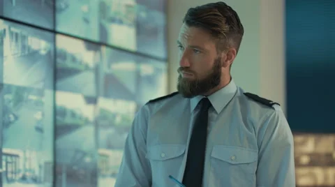4K Security officer watching the screens... | Stock Video | Pond5
