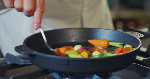 4K Side View Chef Stif Fry Vegetables an... | Stock Video | Pond5