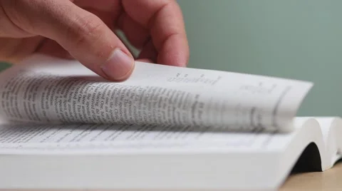 4K Side View Reading The Bible By Turnin... | Stock Video | Pond5
