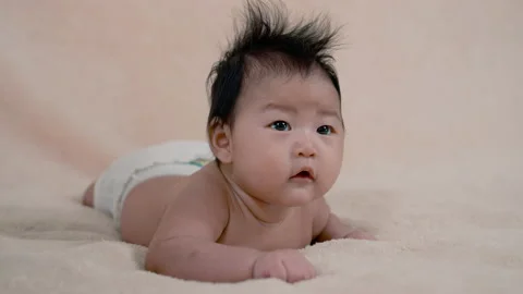 4K, Slow, Asian newborn baby girl, lying... | Stock Video | Pond5